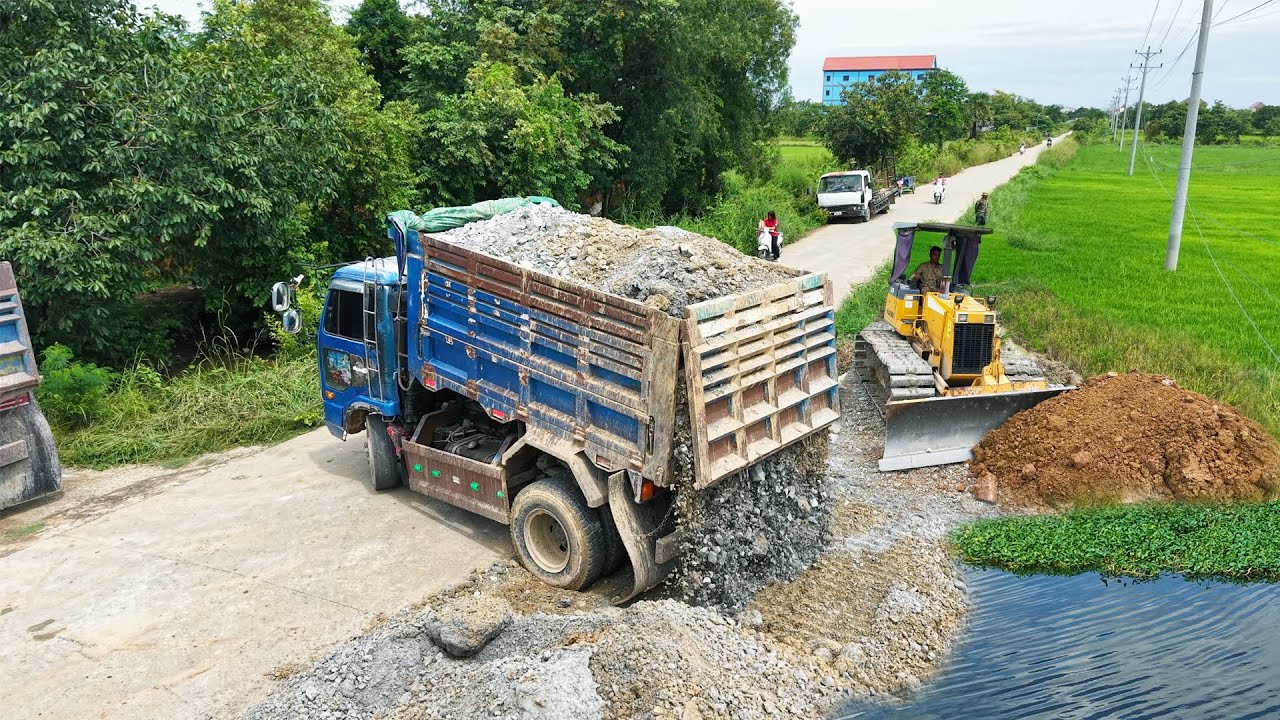 Nice Village! Landfill Processing Dozer Pushing Stone into the rice ...