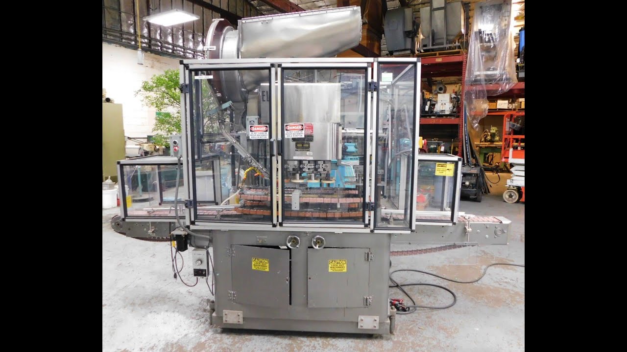 Resina automatic capper, Model U40 - YouTube