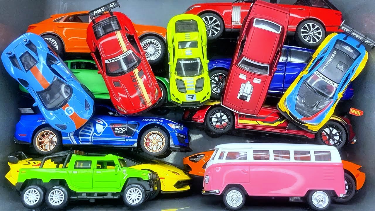 Box full of various miniature cars Peugeot, Volvo, Renault, Hyundai ...