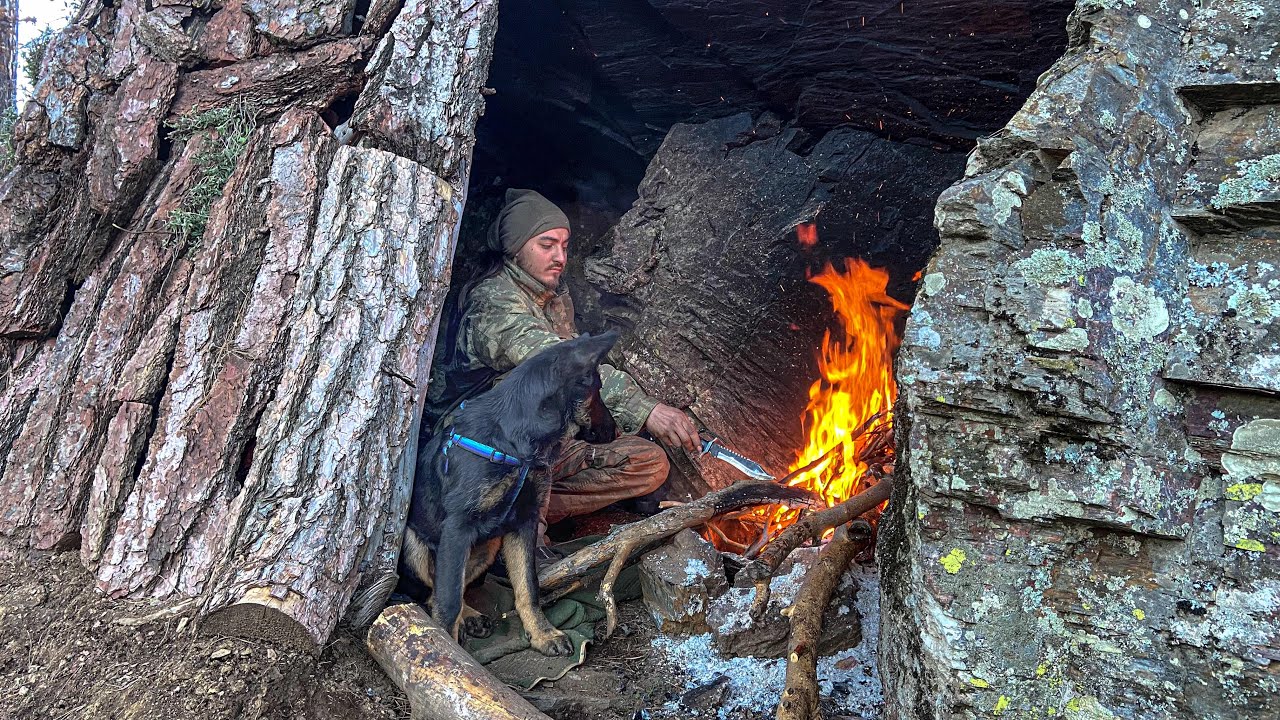 Winter Camping in Stone Survival Shelter - Making Roof With Natural ...
