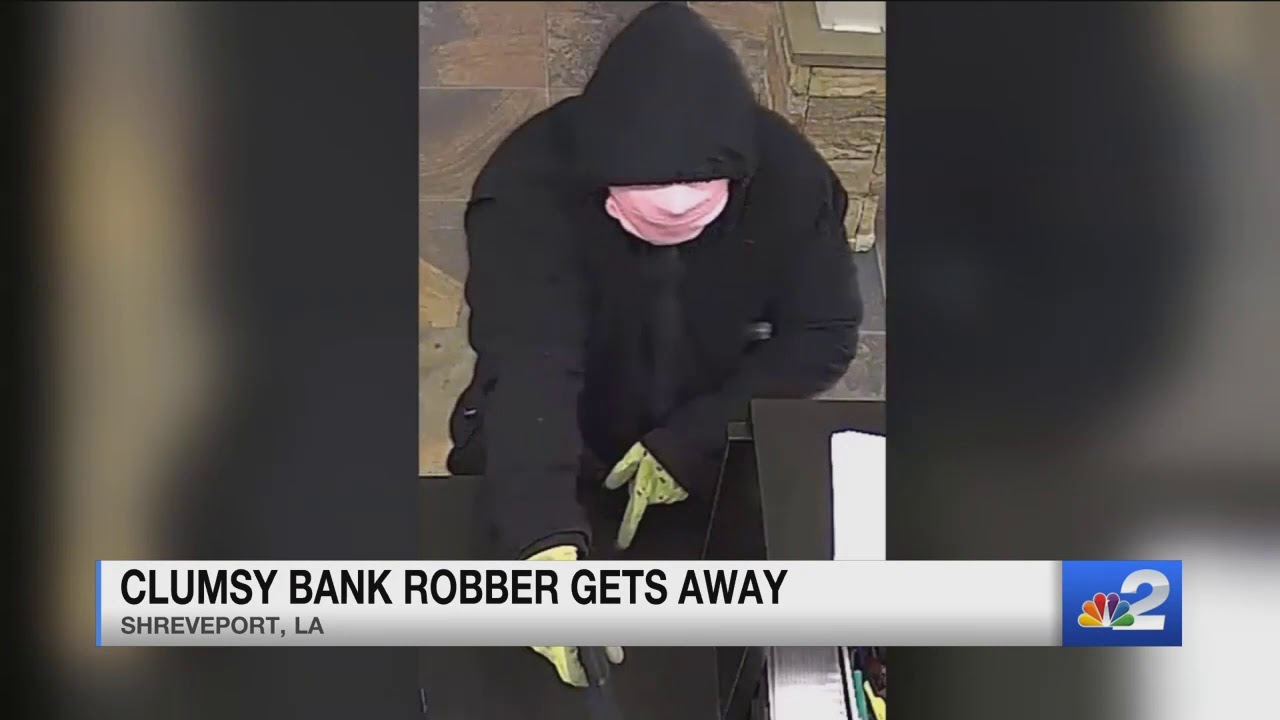 Clumsy bank robber makes his escape despite tripping three times - YouTube