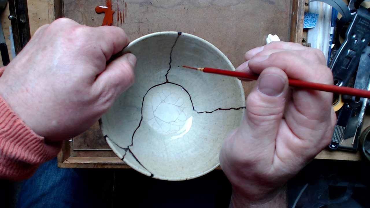 Traditional, lacquer based kintsugi, step 9 , applying red for gold ...