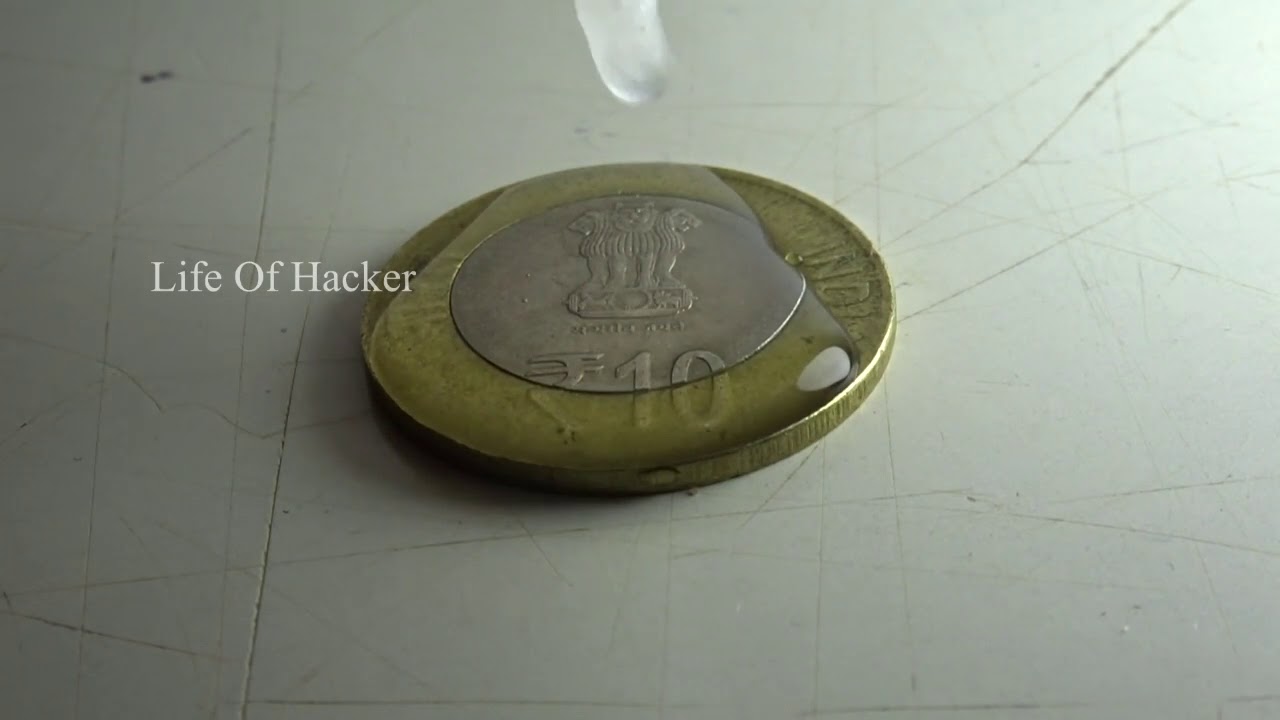 How many drops of water can you fit on a 10 rupee coin - YouTube