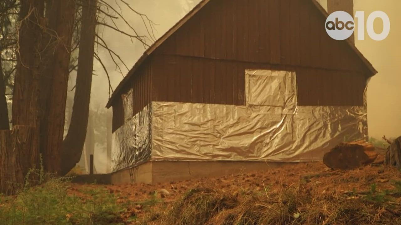Cabin wrapped in foil-like covering to keep the wildfire away - YouTube