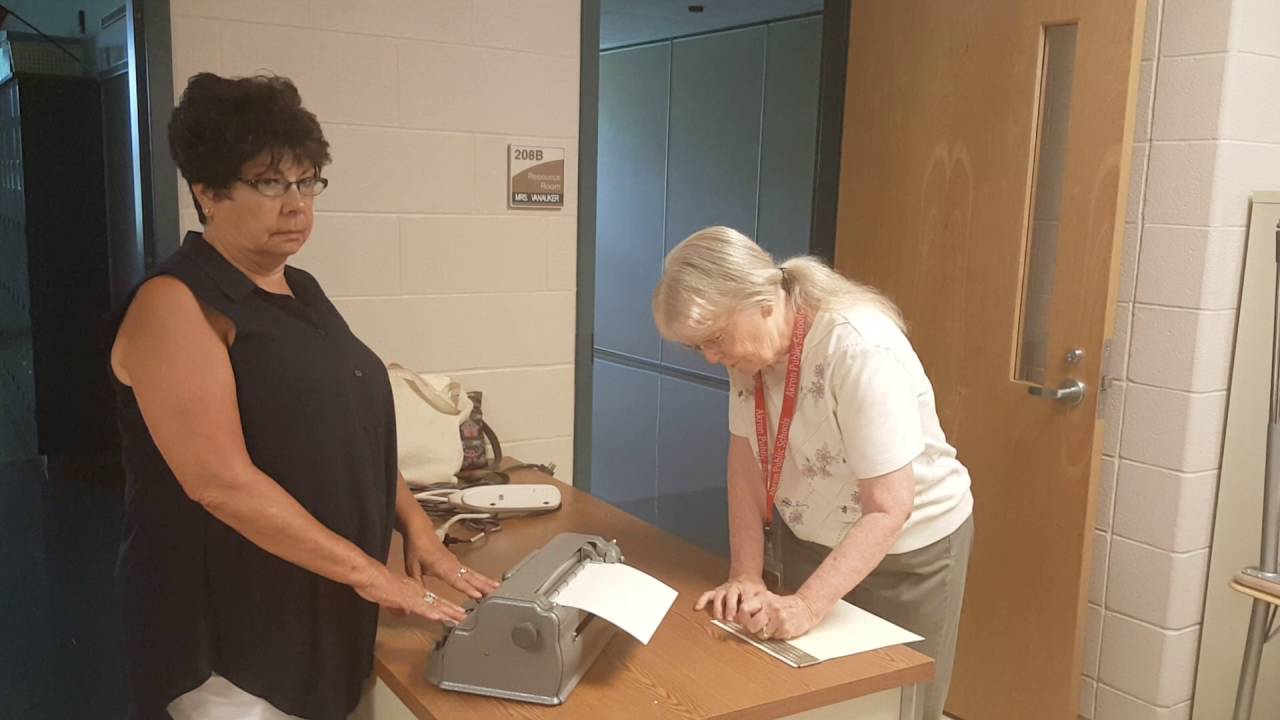Bonita Ferracane and Susan Mertz write letters of the alphabet with a ...