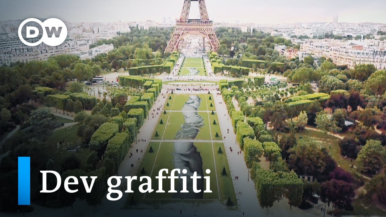 Eyfel Kulesi’nin önünde dev graffiti - DW Türkçe - YouTube