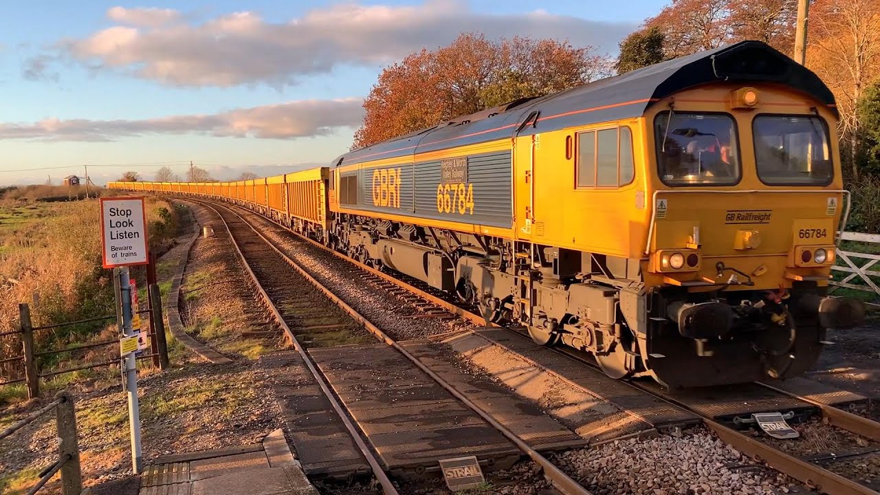Class 66 GBRf 66784 Network Rail Ballast Train passing through rural ...