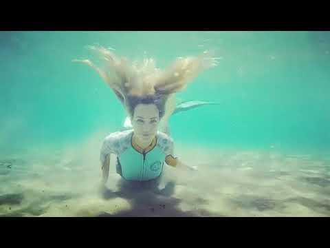 Woman lying on the bottom of the ocean underwater - YouTube
