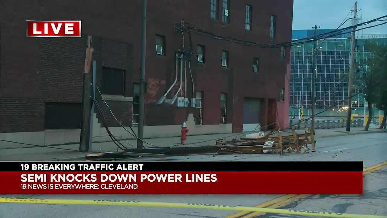 Cleveland power pole knocked over by semi truck, outages reported - YouTube