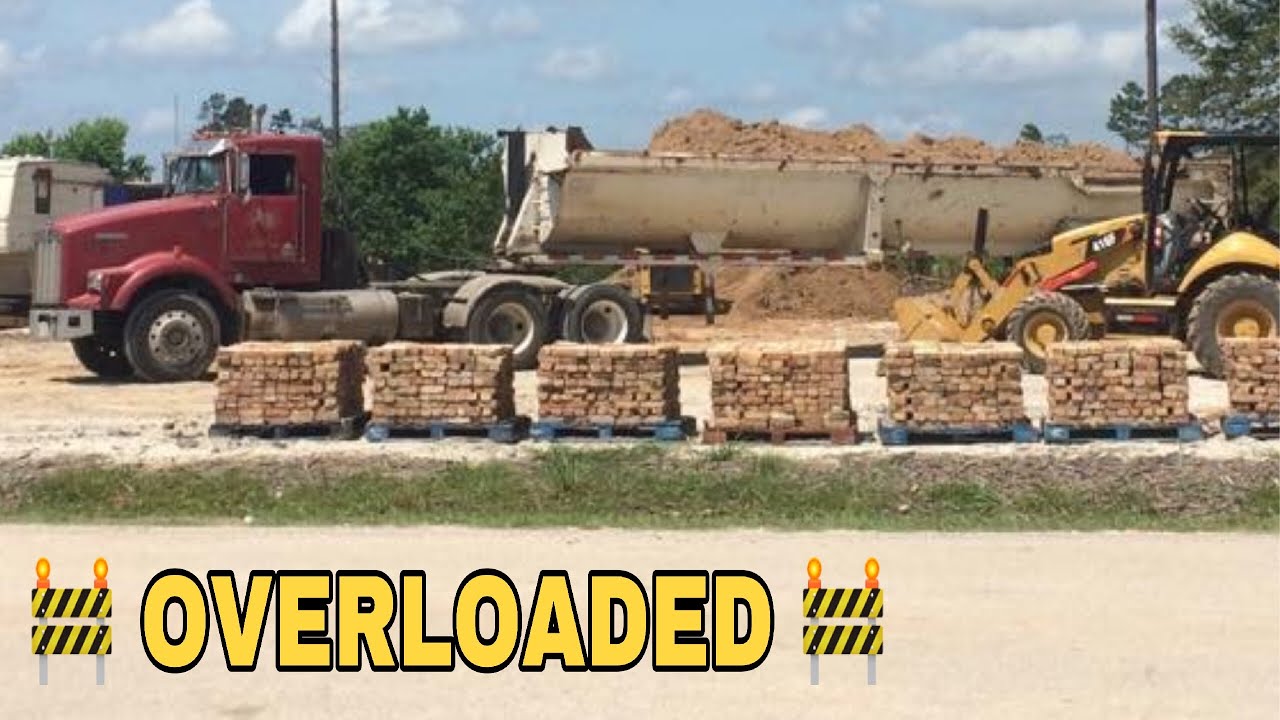 Overloaded end dump trailer - YouTube