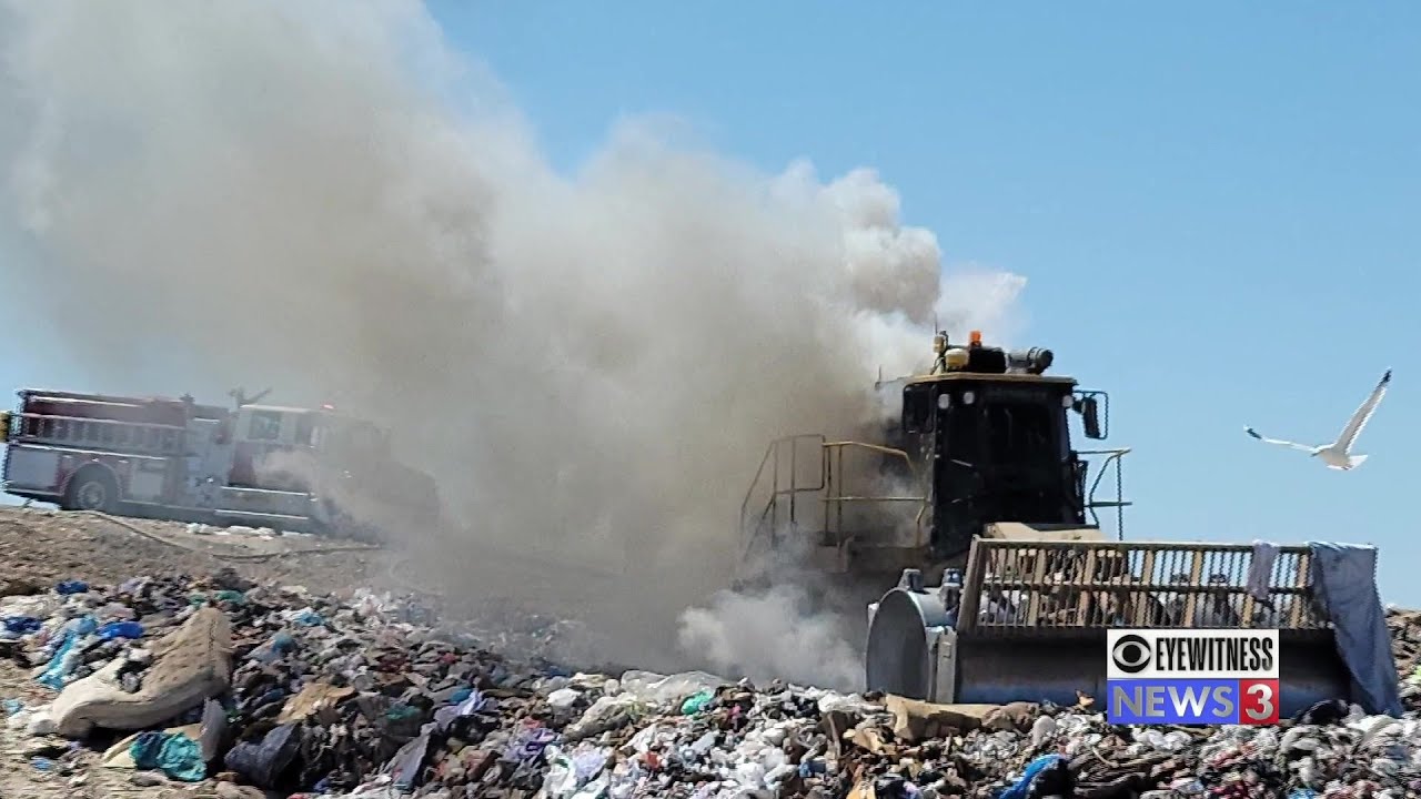 Landfill compactor catches fire - YouTube