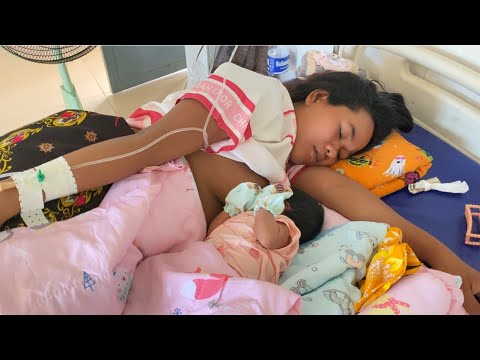 Mother breastfeeds her baby after giving birth.