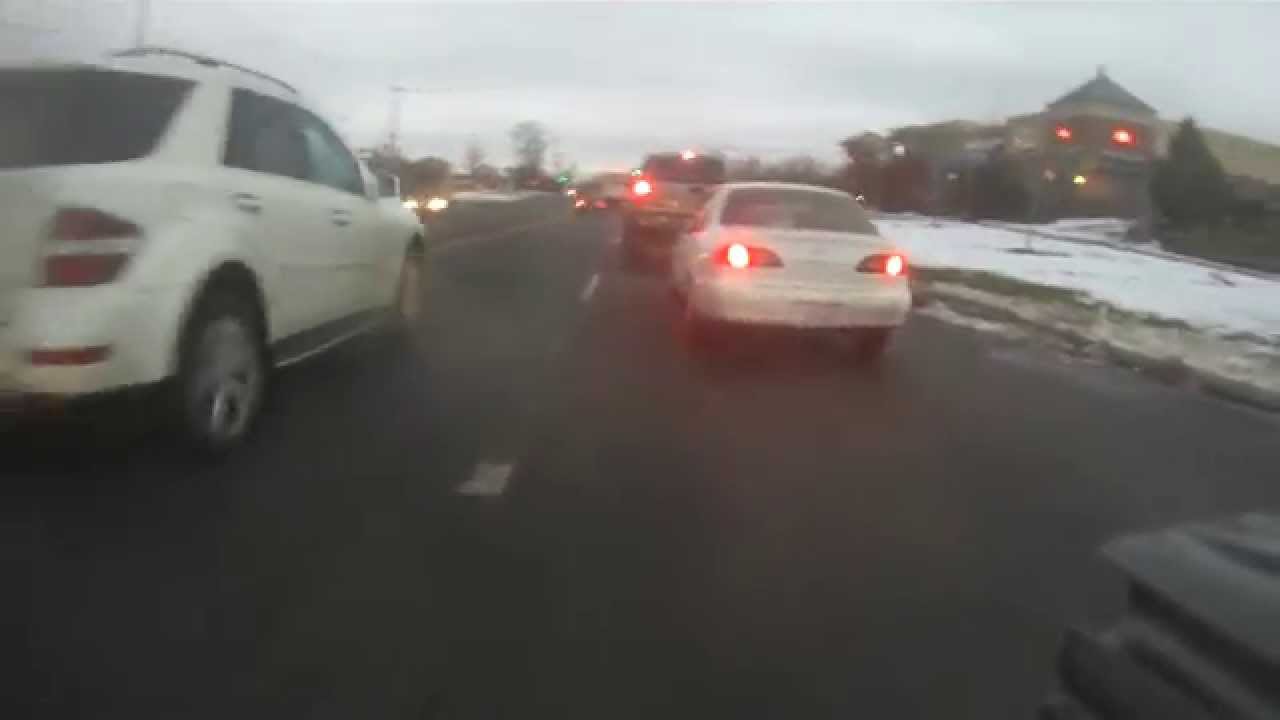 Two cars passing on the right over solid white lines in right turn only ...