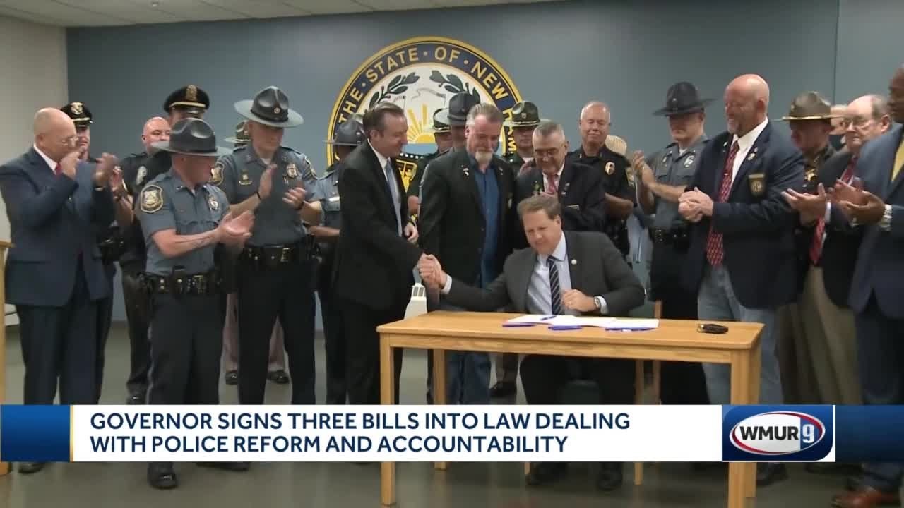 Governor signs three police reform bills into law - YouTube