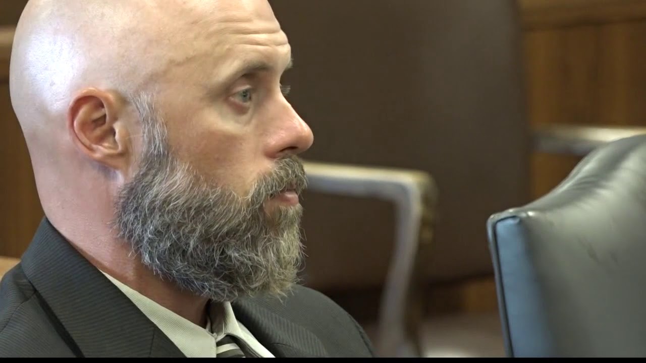 SPD officer awaits decision on trial location - YouTube