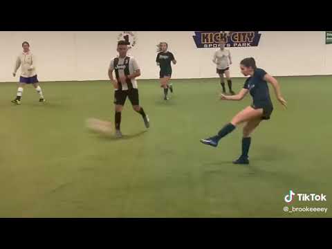 Nutshot! She kicks the soccer ball into his balls
