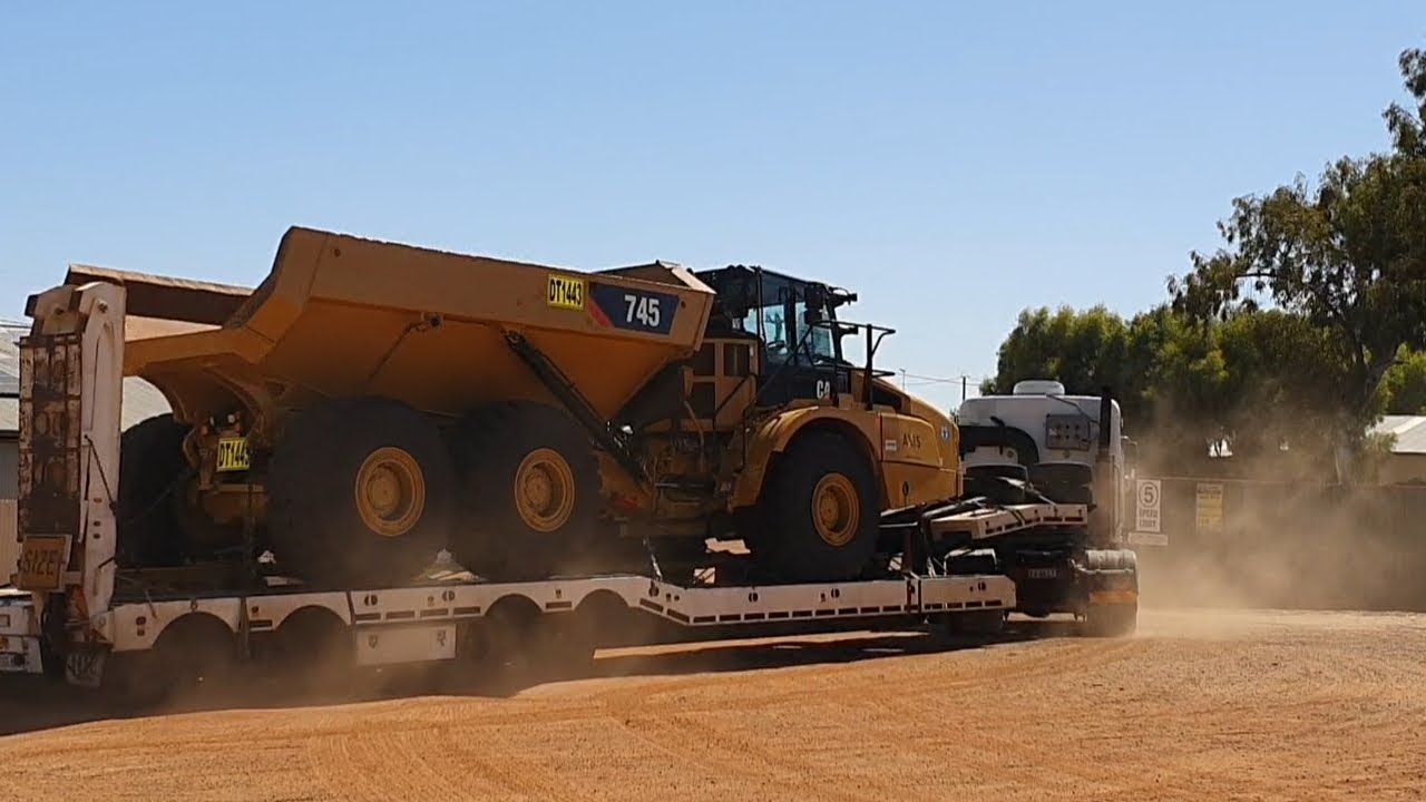Freightliner Argosy hauling an oversize load CAR 745 articulated dump ...