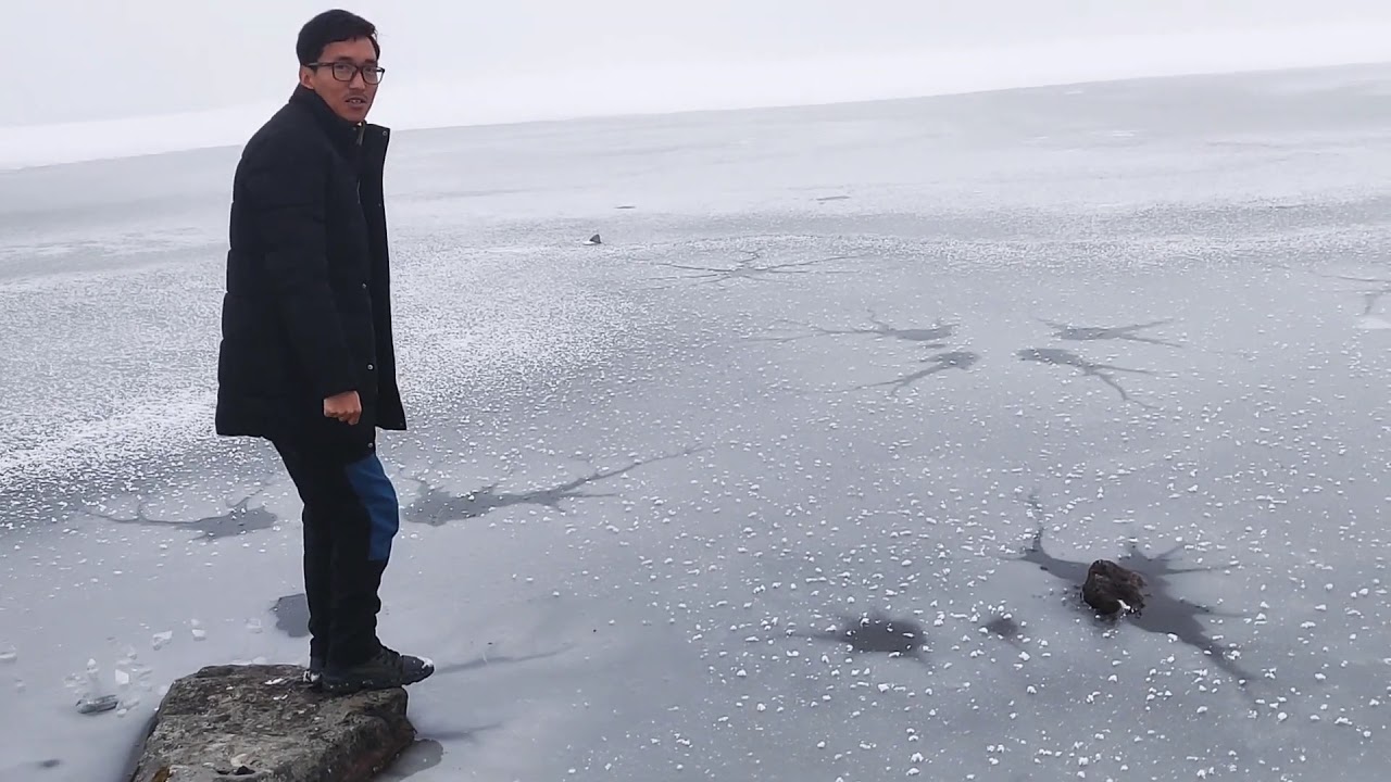 Tenzin Gombu Walks on Frozen PTSO LAKE, Tawang - YouTube