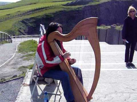 Ireland video 9 - Lady playing harp at Cliffs of Moher - YouTube