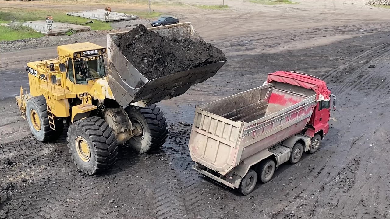 Caterpillar 990 Wheel Loader Loading Mercedes & MAN Trucks With Two ...