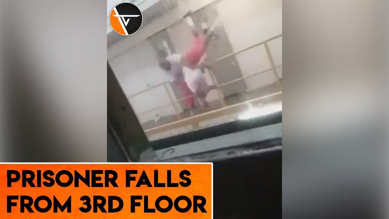 Prisoner falls from the 3rd floor as he gets thrown off the walkway ...
