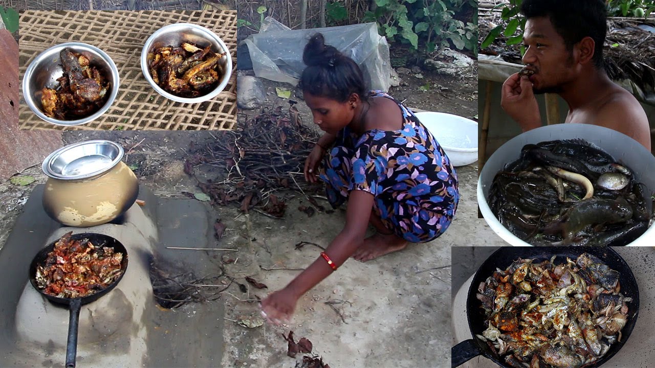 village tribe women cooking fish in tradition way of eating lifestyle ...