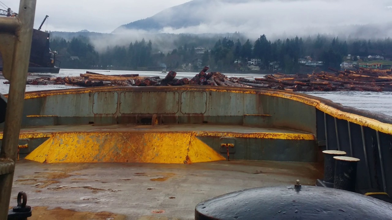 Self dumping log barge. - YouTube