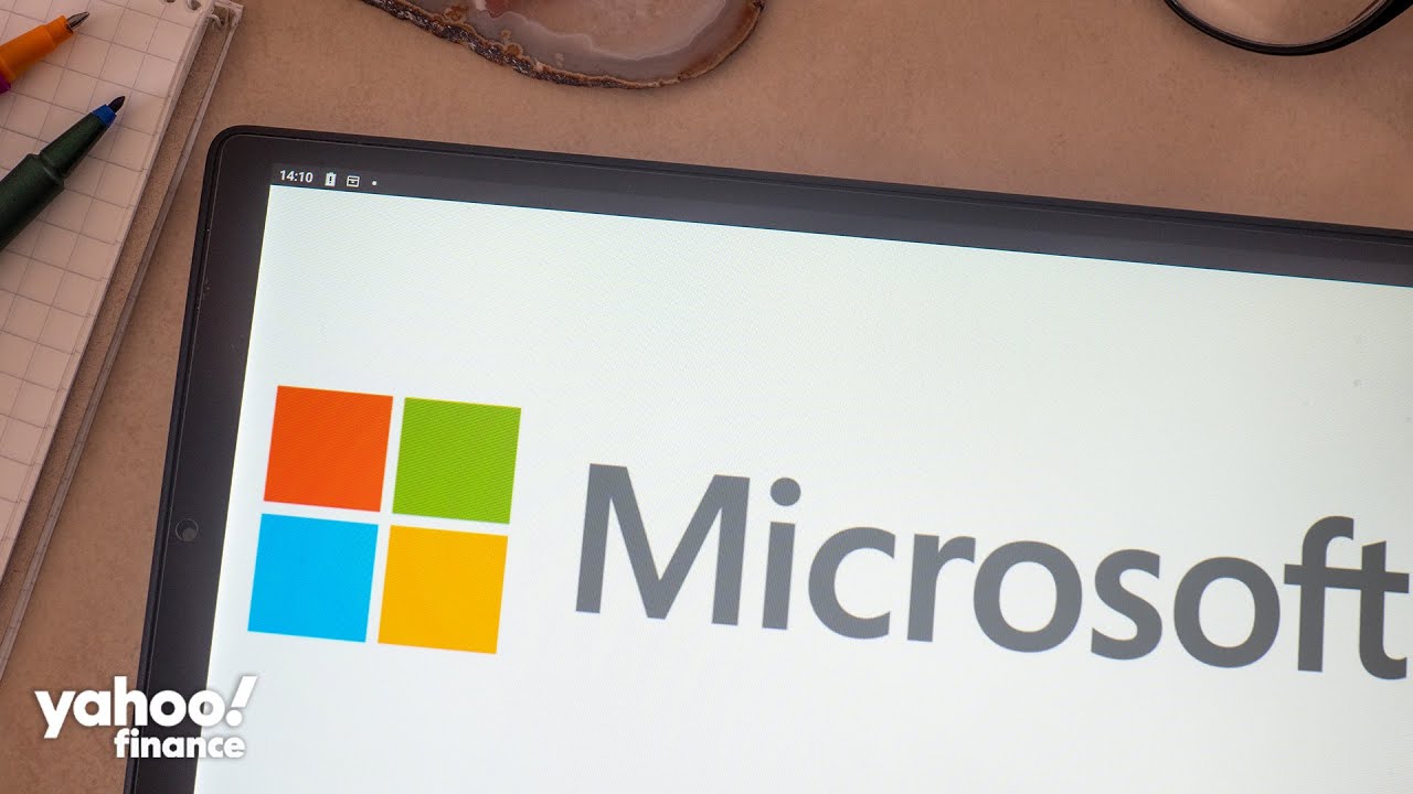 Microsoft stock slips after tech giant lowers earnings outlook - YouTube
