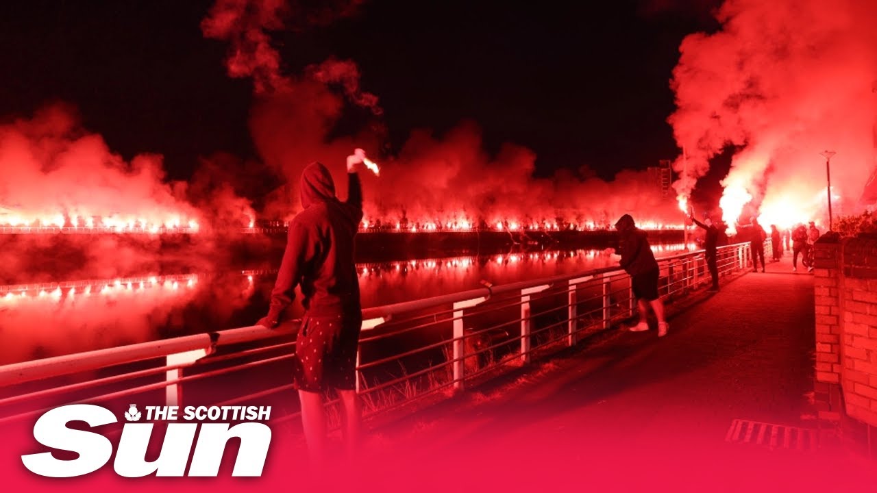 Rangers fans painted the town red by setting off flares on either side ...