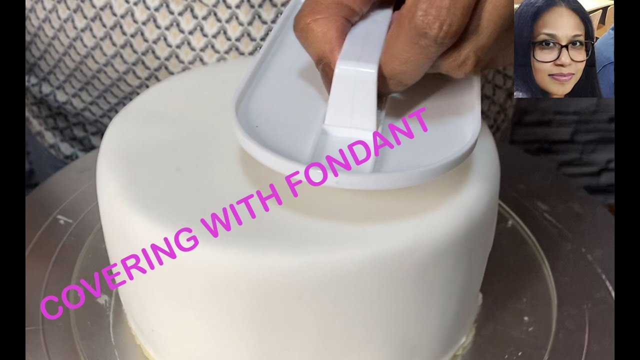 Covering a cake with fondant icing - YouTube