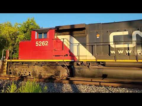 CN 8823, 5262 handle a Westbound variety freight train with a GTW blue box car at Vicksburg, MI ...