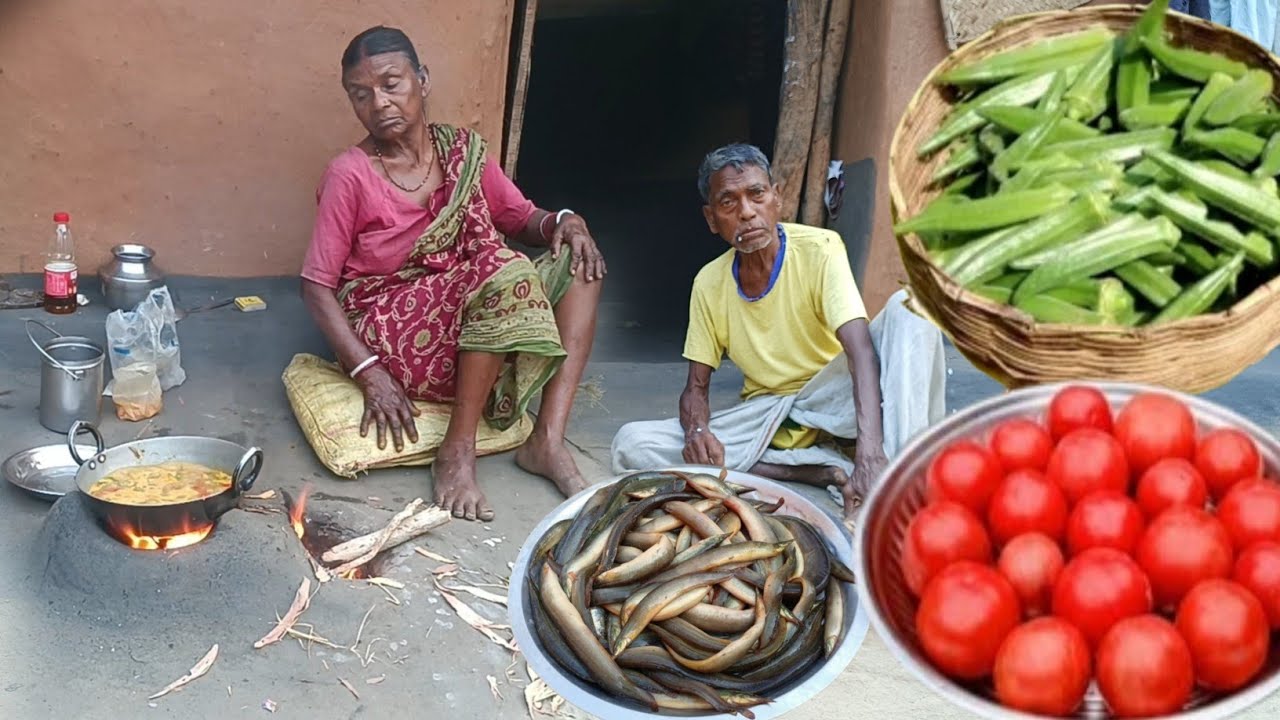village poor man cooking small SNAKE FISH curry with ladyfinger in ...