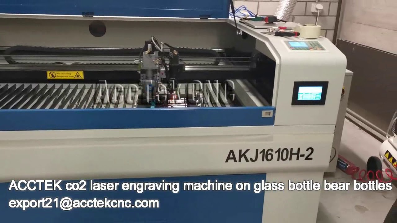 ACCTEK co2 laser engraving machine on glass bottle bear bottles - YouTube
