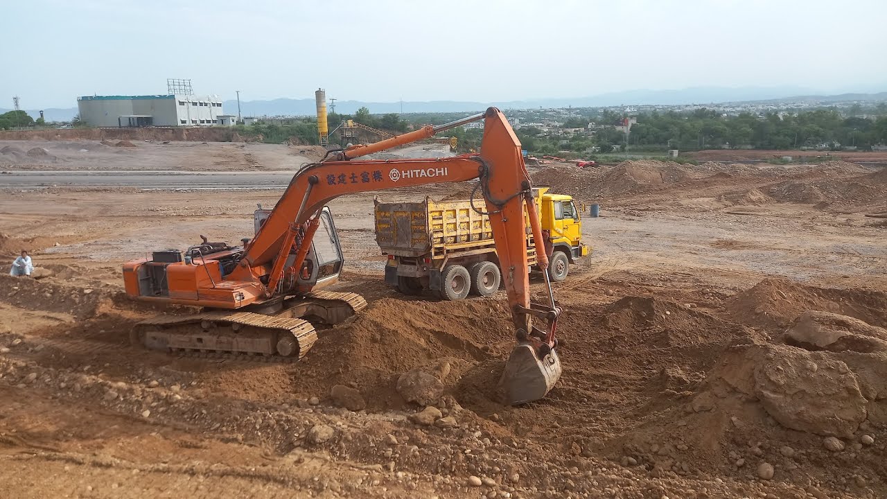 Excavator loading dumper. Dozer cutting - YouTube