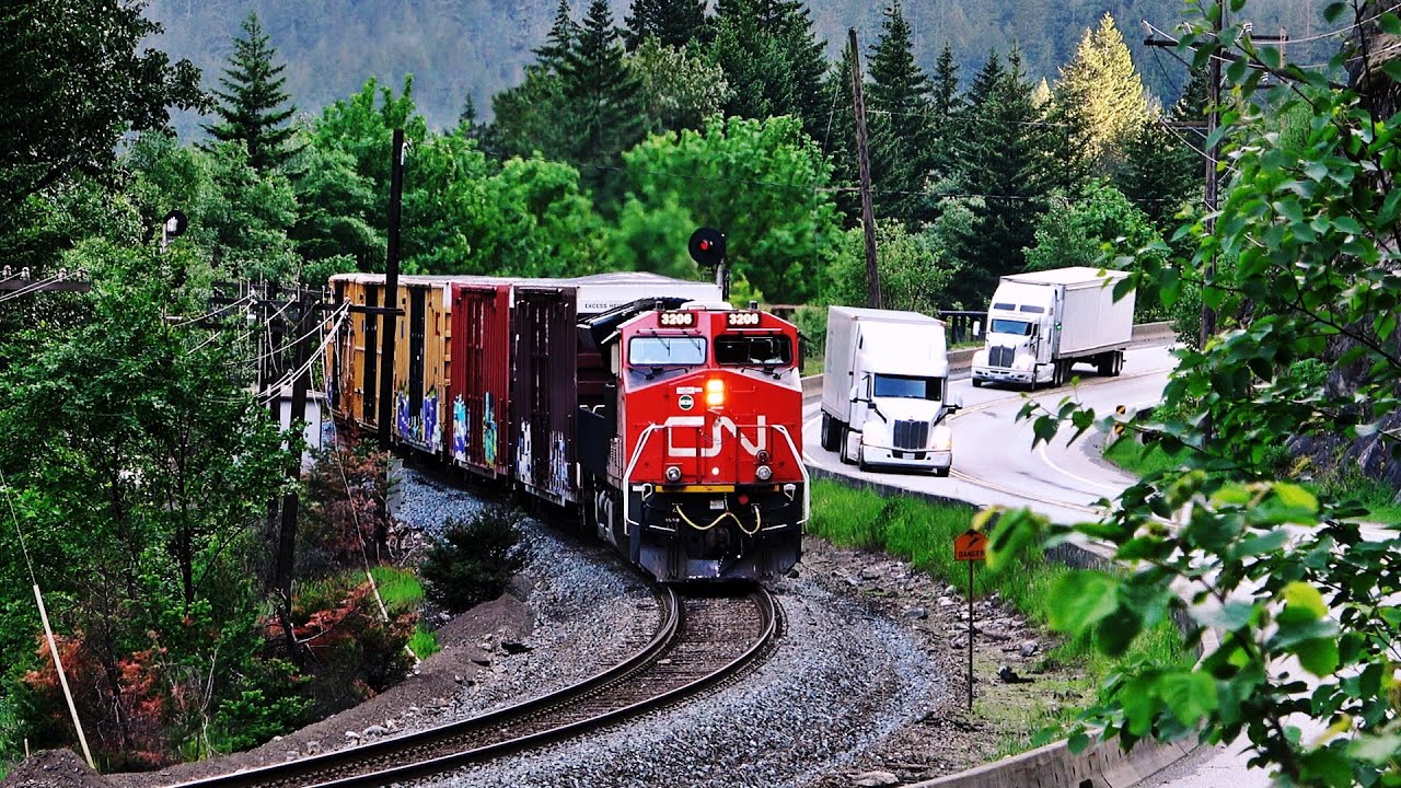 Trains And Trucks Following The Trans-Canada Hwy In British Columbia ...