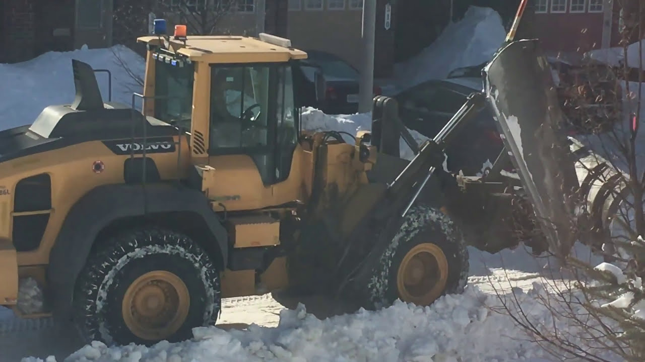 Snow Plowing Operation with Heavy Equipments including Trucks, Backhoes ...
