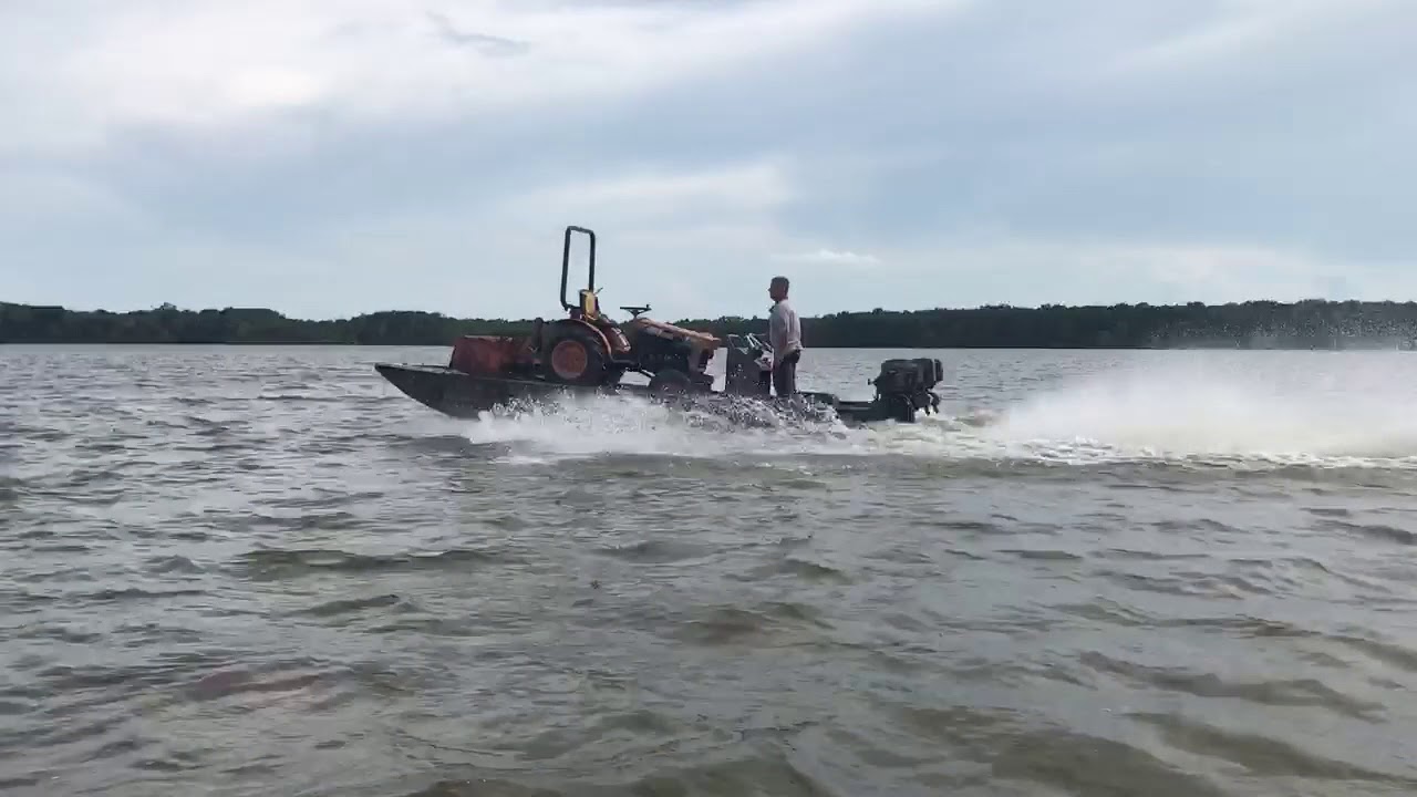Pro-Drive Boat Hauling a Tractor - YouTube