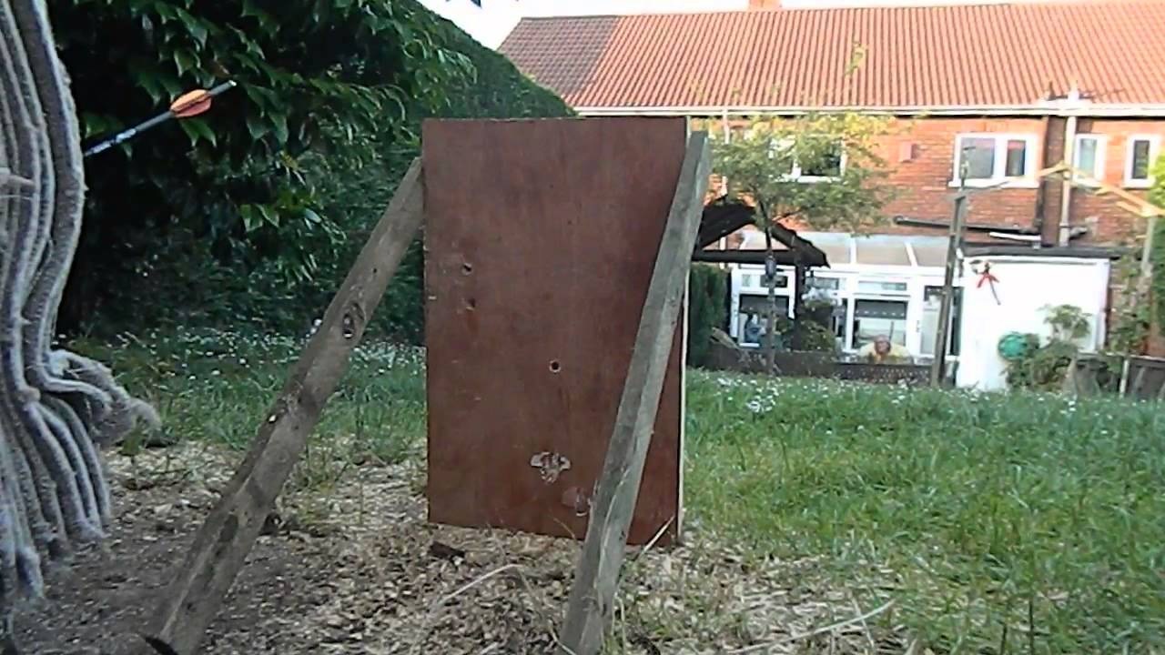 Mantis crossbow shooting through a piece of 18mm Plywood at close range ...