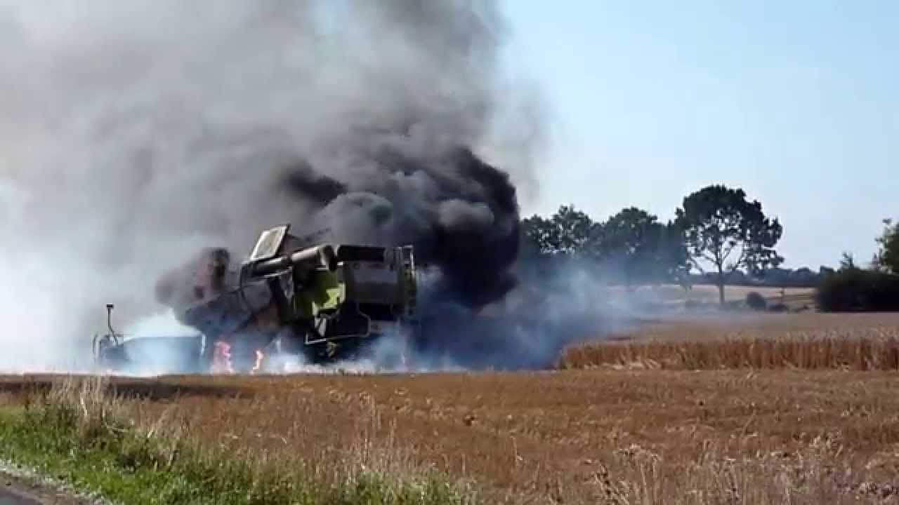 Burning Claas combine harvester sets fire to crops. - YouTube