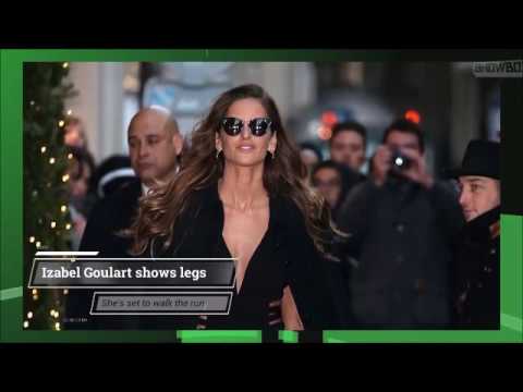 Izabel Goulart shows off her endlessly long legs in a mini dress
