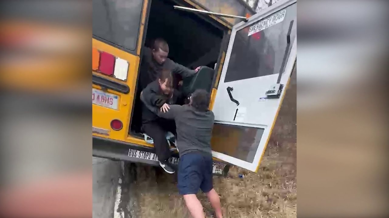 Students rescued after school bus sinks, tips in mud - YouTube