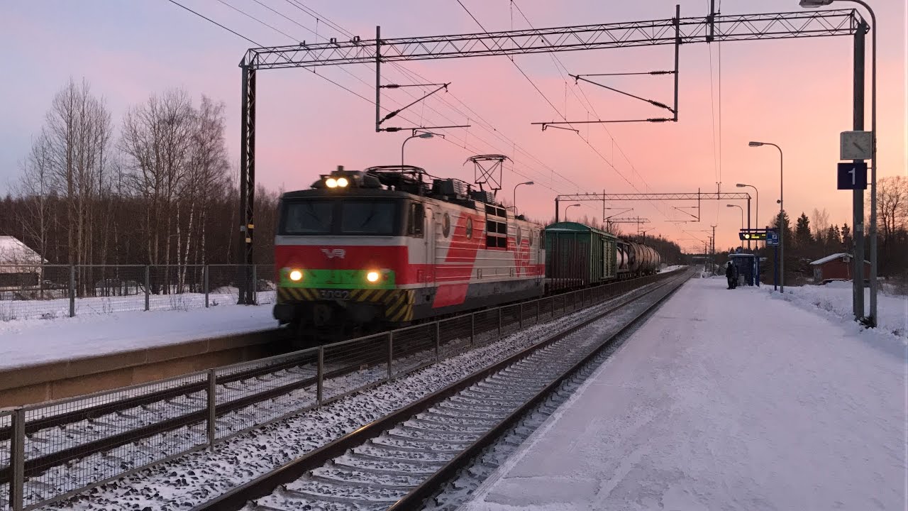 Finnish freight trains passing Viiala Station on a beautiful winter ...