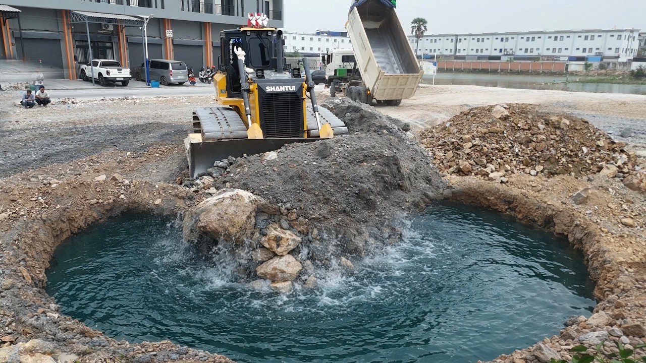 Awesome Land Filling Process Bulldozer Pushing Soil Mixed Stone ...