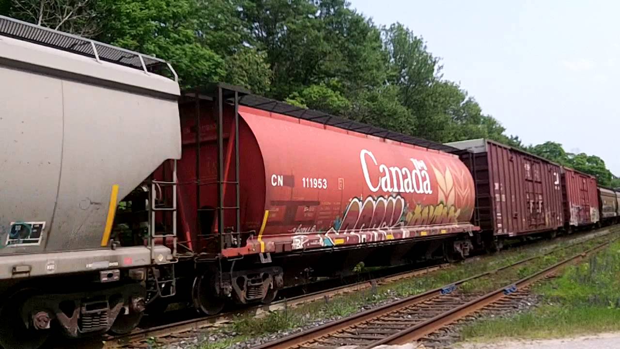 CN 107 w/ CN Engine 2824 Running Solo leads this long NB mixed ...