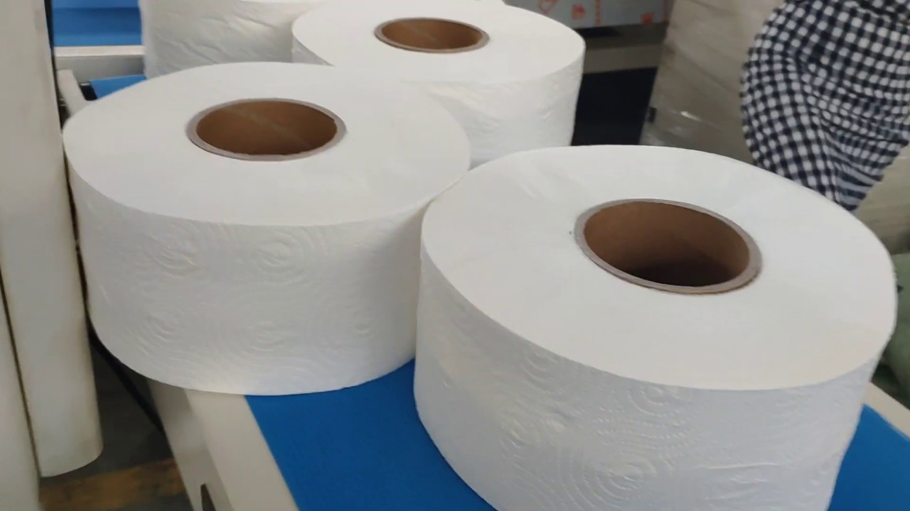 Automatic maxi roll jumbo roll tissue paper rewinder and cutter - YouTube