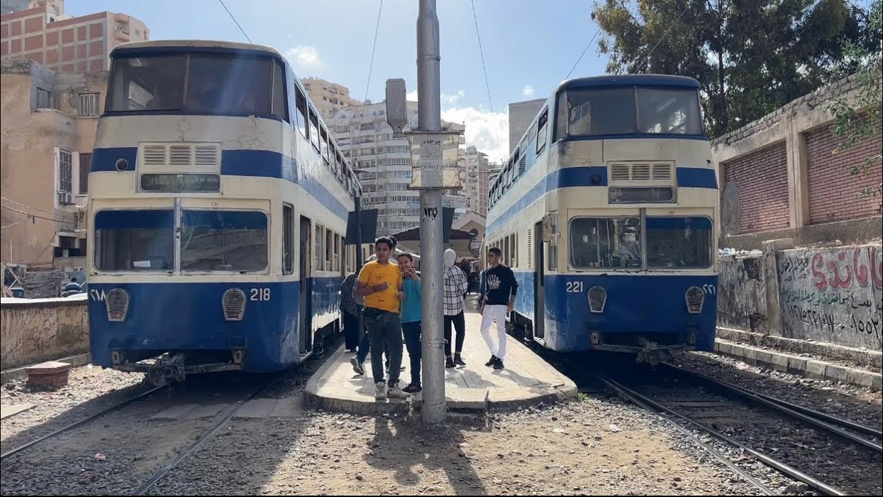 El Nasr station Alexandria Egypt. Two double-decker trams or double ...