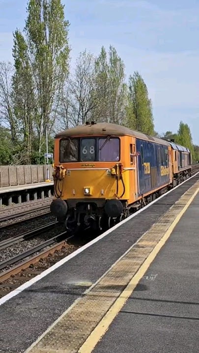 GBRf 73128 O.V.S. Bulleid C.B.E + 66774 passing West Byfleet #73128 ...