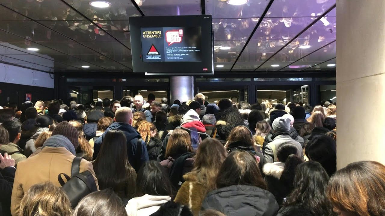 Passengers cram into Paris metro station amid transport strike chaos ...