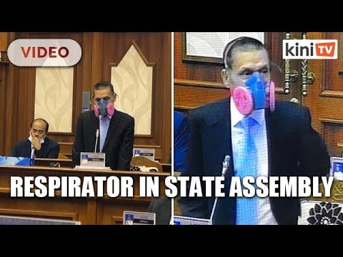 Ex-Pahang MB shows up at state assembly with pink respirator - YouTube