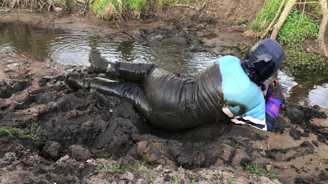 Mud jumping in my to small snowsuit - YouTube
